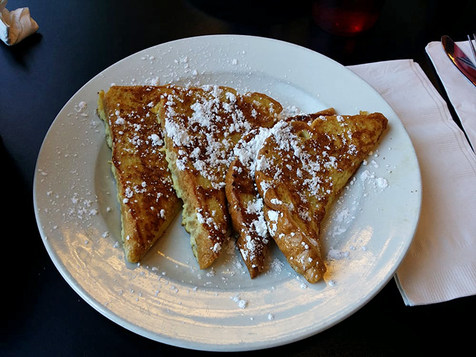French toast that doesn't need a passport to impress, dusted with powdered sugar like the first perfect snowfall of winter.