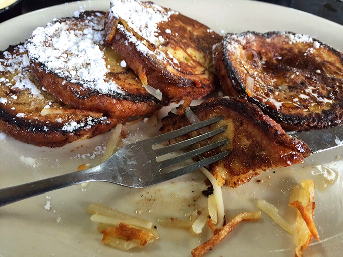 French toast that's been kissed by the griddle until golden brown, then dusted with powdered sugar. Breakfast or dessert? The line deliciously blurs.