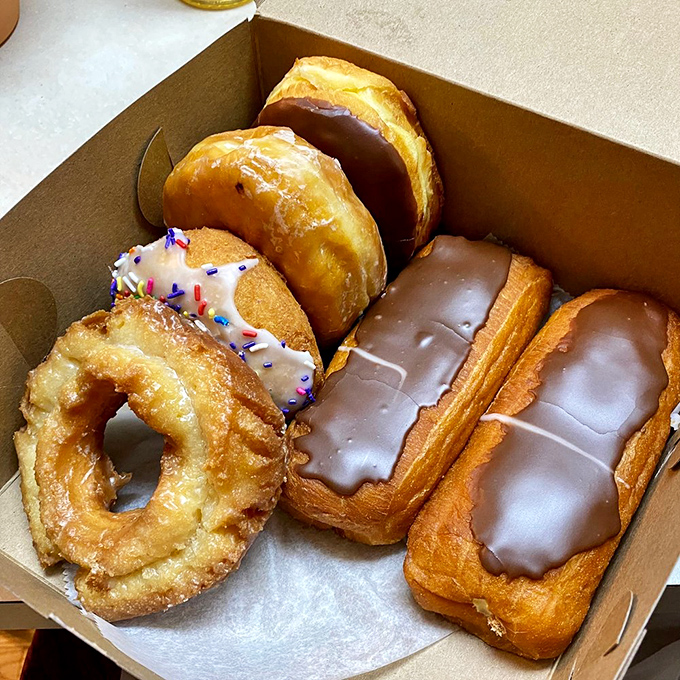 A cross-section revealing the tender soul of perfection. This is donut DNA at its finest—studied but never duplicated.