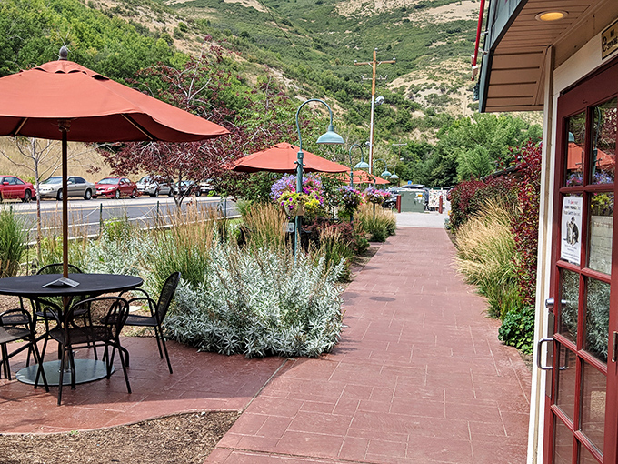 Garden pathway that promises culinary rewards. The landscaped entrance sets the stage for the feast that awaits just beyond those red doors.
