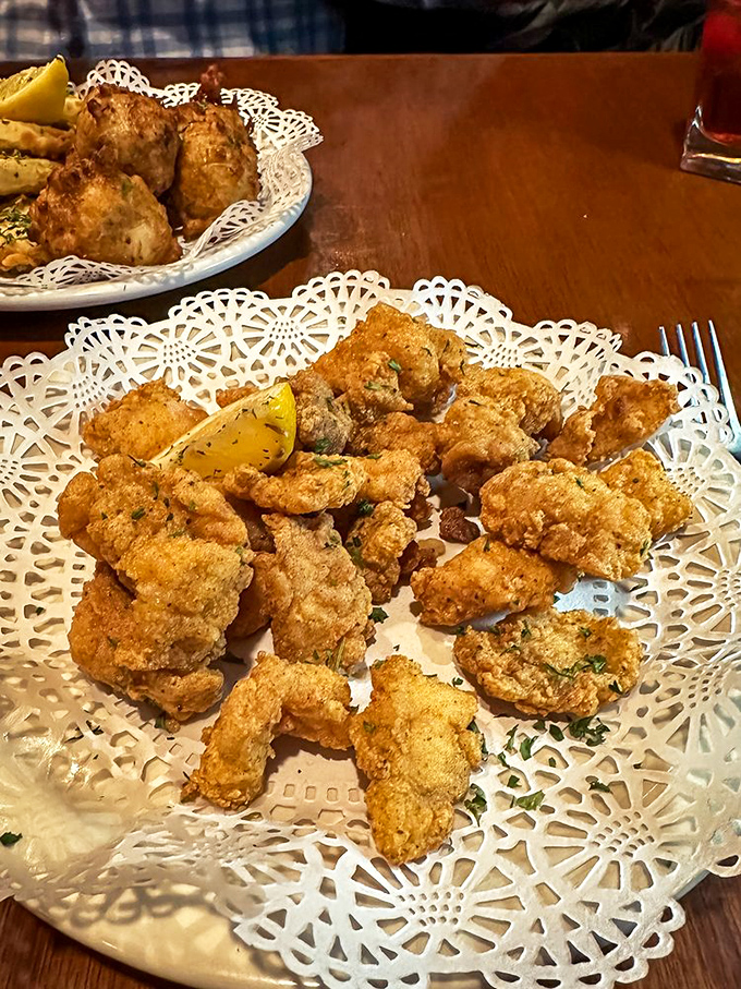 Golden-fried gator bites on grandmother's doily. What looks like fancy presentation is actually just Florida's way of saying "trust us, you'll love this."