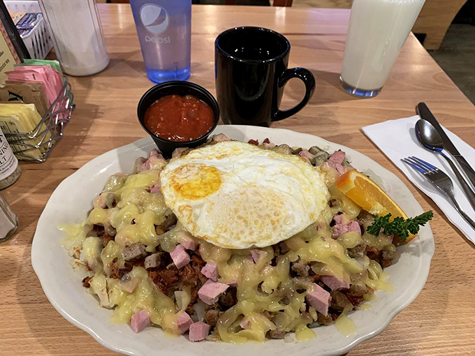 This isn't just breakfast &ndash; it's an edible work of art where crispy hash browns, country gravy, and perfectly cooked eggs create a symphony of morning flavors.