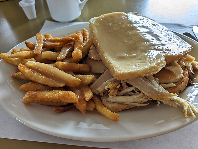Pancakes the size of vinyl records that make you wonder if the kitchen has special structural engineers on staff just for breakfast.
