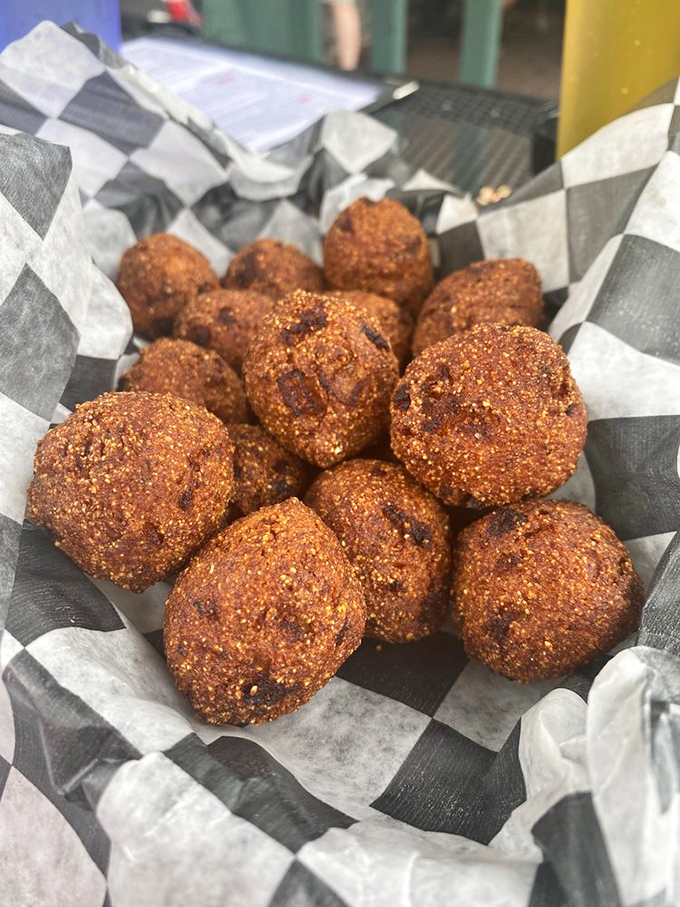Hush puppies that deserve to speak loudly about their perfect crunch. These golden orbs of cornmeal joy would make any Southern grandmother nod in approval.