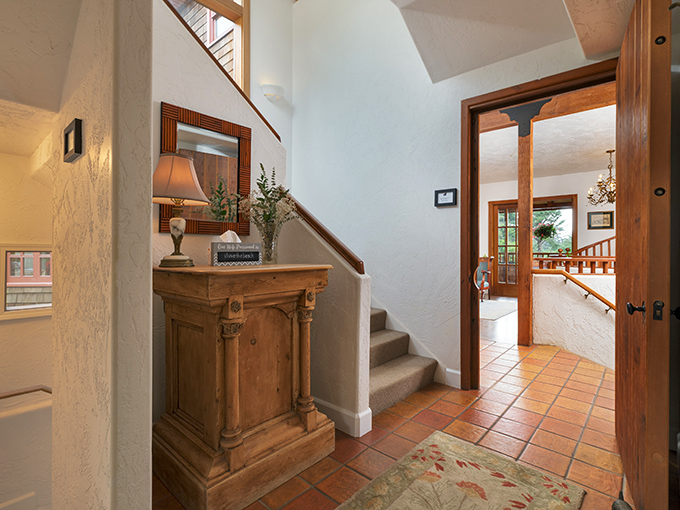 The living area's warm wood tones and comfortable seating invite you to linger with a book or share stories of the day's adventures.