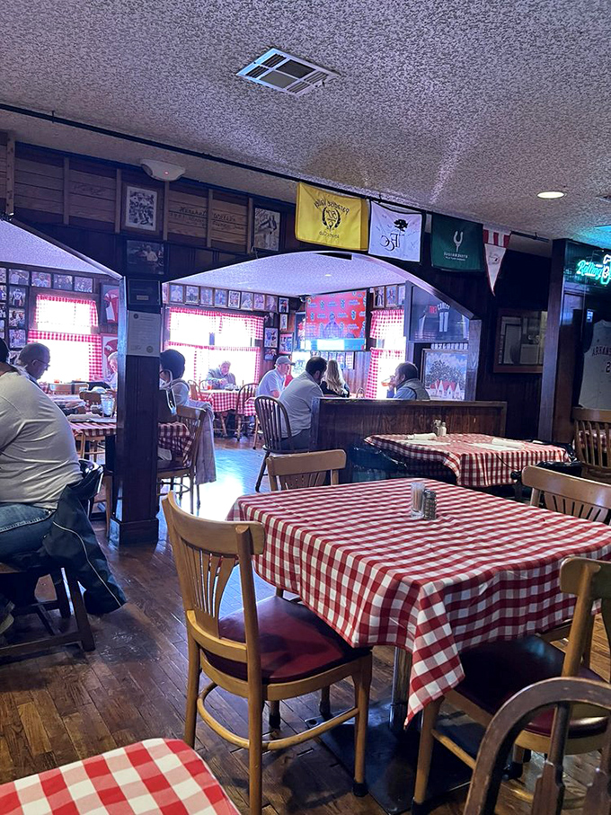 The unpretentious dining room with its wooden chairs and checkered tablecloths creates a warm backdrop for memorable meals and Arkansas conversations.