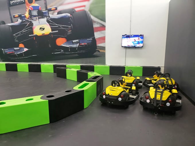 Junior racers start their journey here. These yellow machines are where future NASCAR dreams begin—and parents' nervous sweating commences.