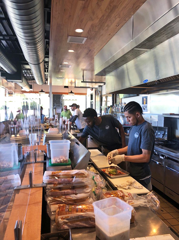 The unsung heroes of flavor, crafting each sandwich with the focus of artists and the efficiency of pit masters who know good BBQ takes work.