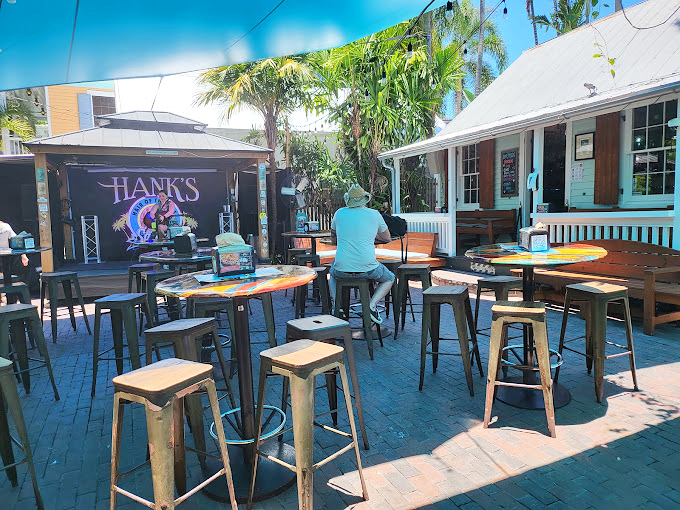 Hank's sign reminds you that in Key West, the best dining experiences often hide in plain sight, waiting for curious food lovers.