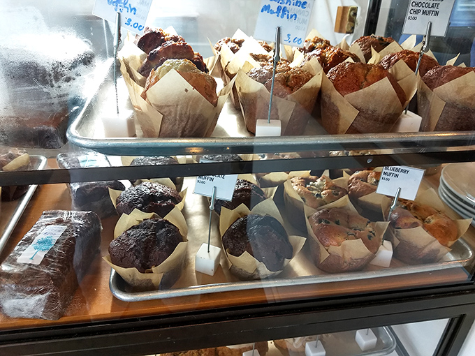 Muffins wrapped in parchment like little gifts waiting to be unwrapped. The chocolate ones are practically calling your name.