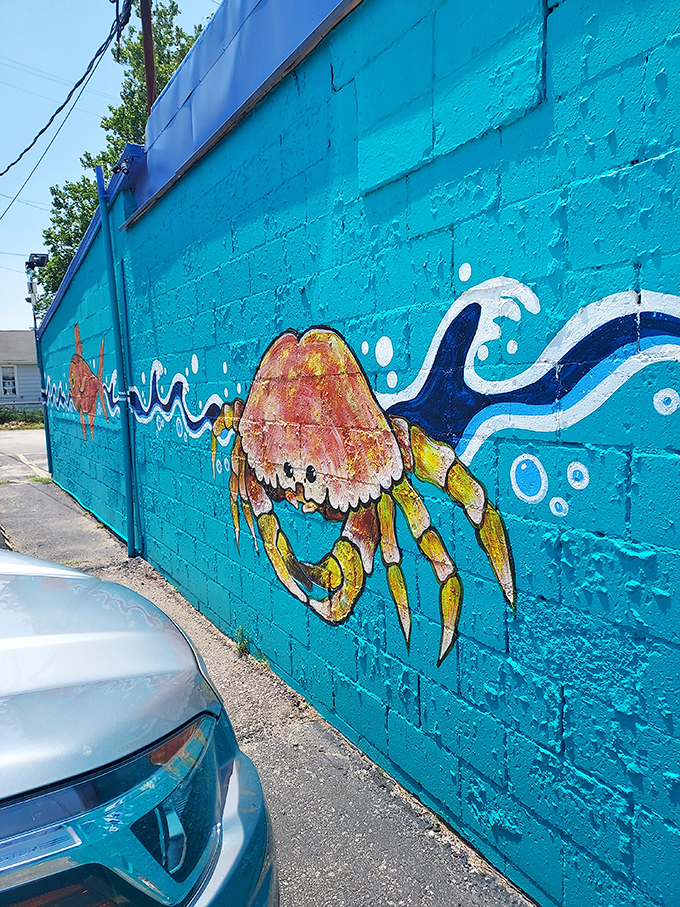 The crab mural crawls across the turquoise exterior, a colorful promise of the crustacean delights waiting inside.