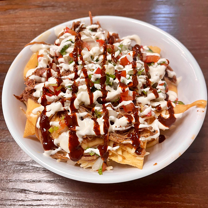 Loaded nachos that require a strategy to eat&mdash;each chip a delivery vehicle for maximum topping coverage and flavor impact.