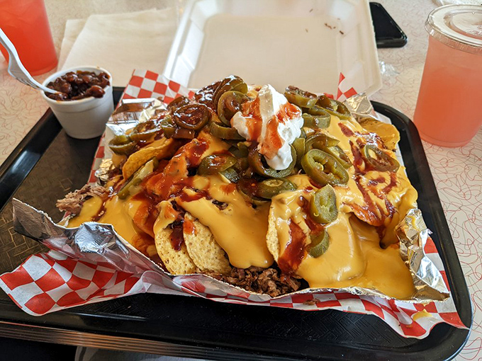 Loaded nachos that make sharing a moral dilemma. This mountain of toppings transforms humble chips into a fiesta worth fighting over.