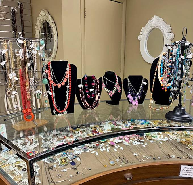 The curated jewelry display case showcases everything from costume pieces to occasional fine jewelry finds&mdash;a miniature museum of personal adornment trends. 
