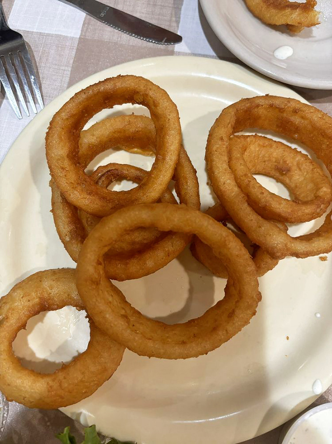 Golden onion rings with that perfect crunch&mdash;the supporting actors that often steal the show from the main course.
