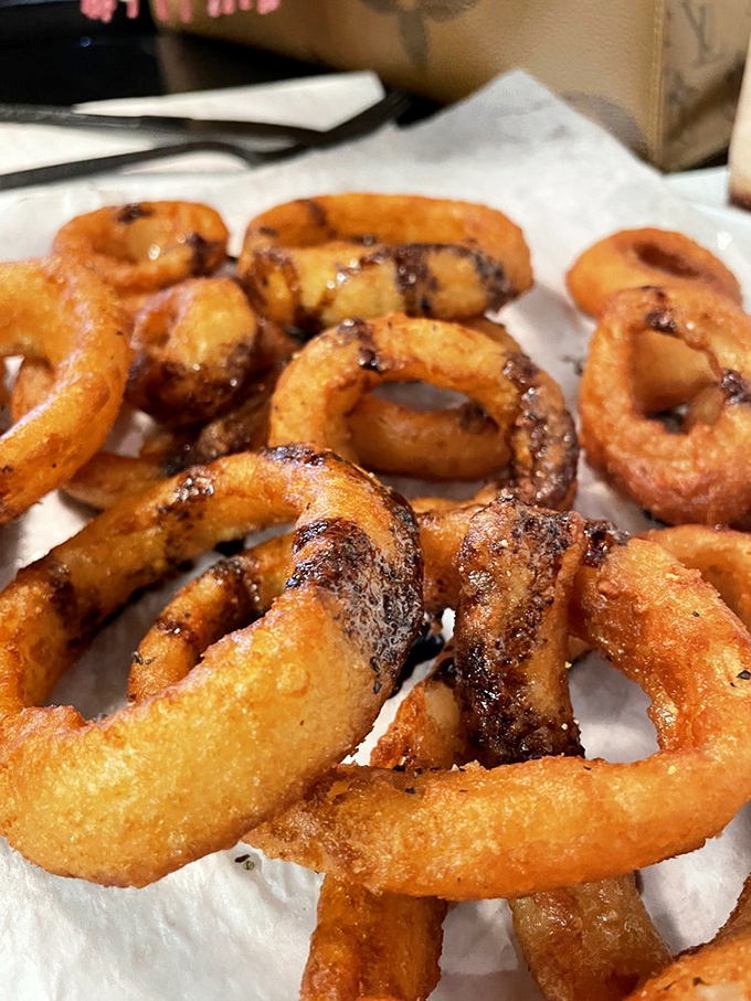 Onion rings so perfectly golden and crisp, they make fast food versions look like sad, oily life preservers for drowning taste buds.