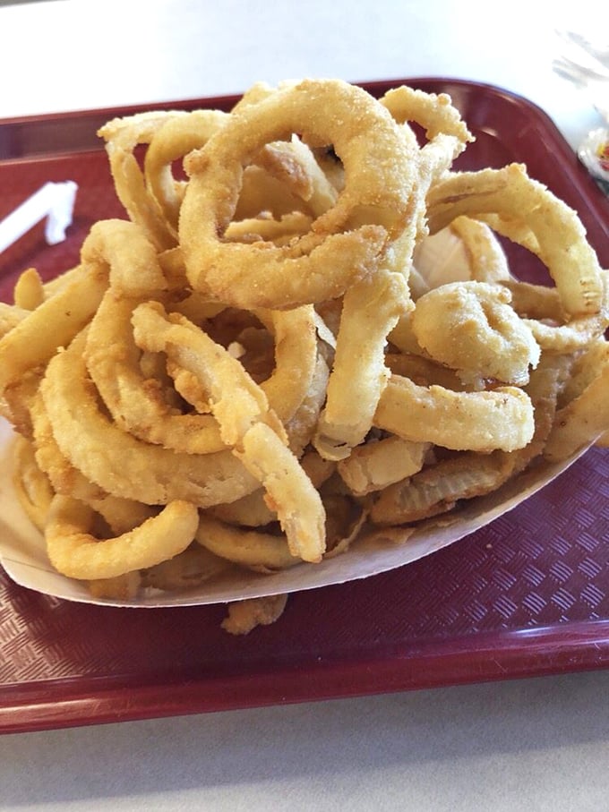 Onion rings that achieve that perfect balance between crispy coating and sweet onion interior&mdash;the unsung heroes of any seafood feast.