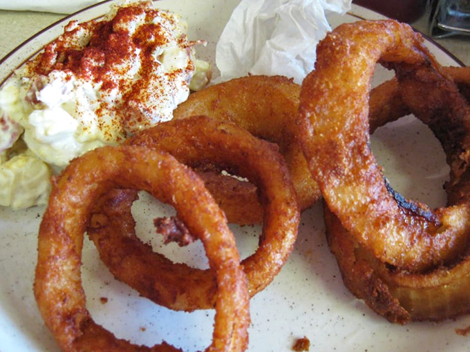 Onion rings that shatter with architectural precision. The perfect sidekick to barbecue&mdash;crunchy where the meat is tender, loud where it's quiet.