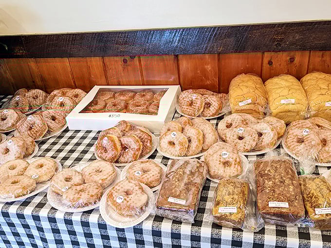 Amish baking laid out like treasures in a wooden chest. Those donuts aren't just round&mdash;they're life preserver-shaped for a reason.
