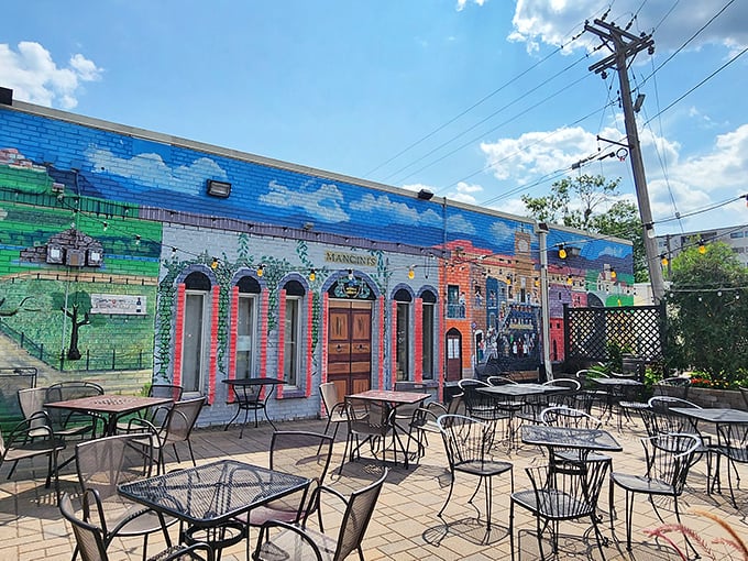 The outdoor patio where summer evenings stretch like taffy and the mural reminds you that dining al fresco is always a good idea.