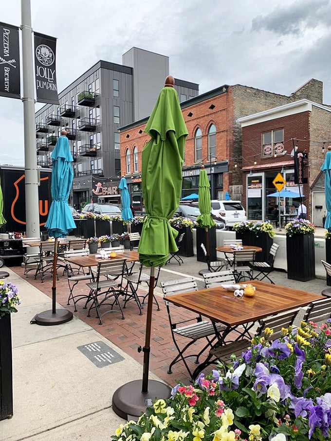 Outdoor seating that captures Grand Rapids' evolving urban landscape. Those colorful umbrellas aren't just for shade&mdash;they're neighborhood beacons.
