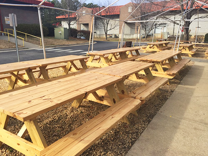 Outdoor seating that invites lingering conversations and second helpings. Simple wooden benches that have witnessed countless seafood epiphanies.