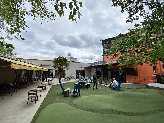 An octopus mural watches over seafood artisans as they prepare oceanic delights that would make Poseidon himself request a reservation. 