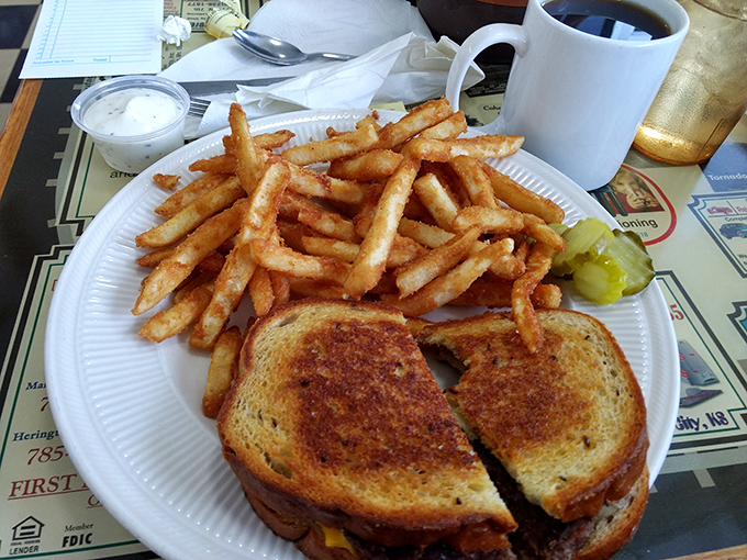 The patty melt – burger's sophisticated cousin who went to college. Perfectly grilled with a side of fries that deserve their own fan club.