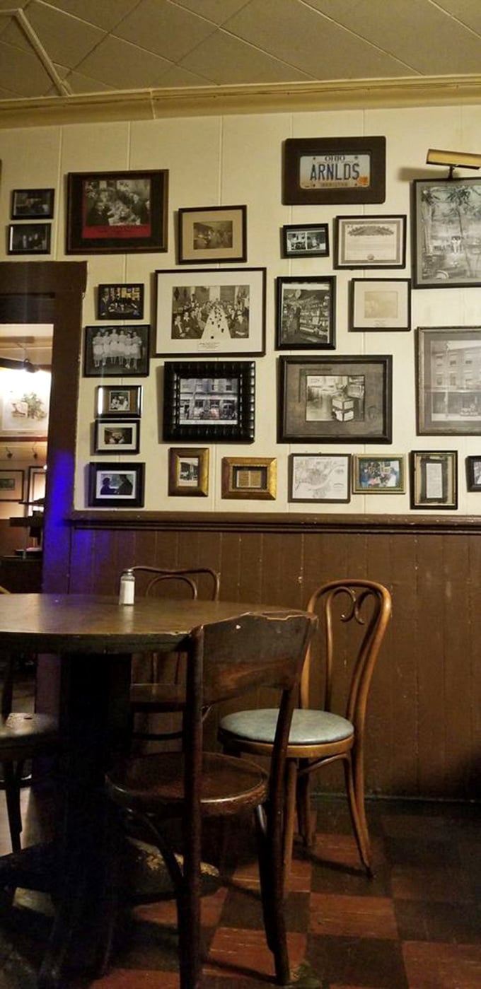 The photo wall serves as Arnold's family album&mdash;generations of memories, celebrations, and that one guy who nobody remembers inviting but everyone was glad came.