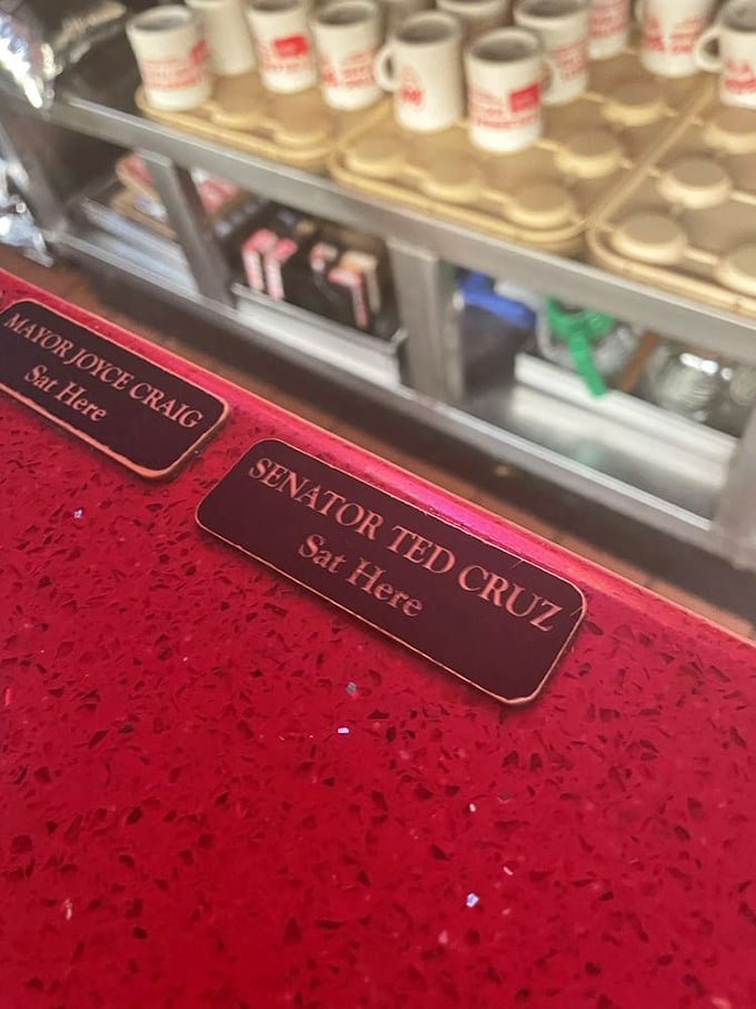 Even politicians find common ground at the Red Arrow. These counter plaques mark where the powerful come to remember what real people eat.