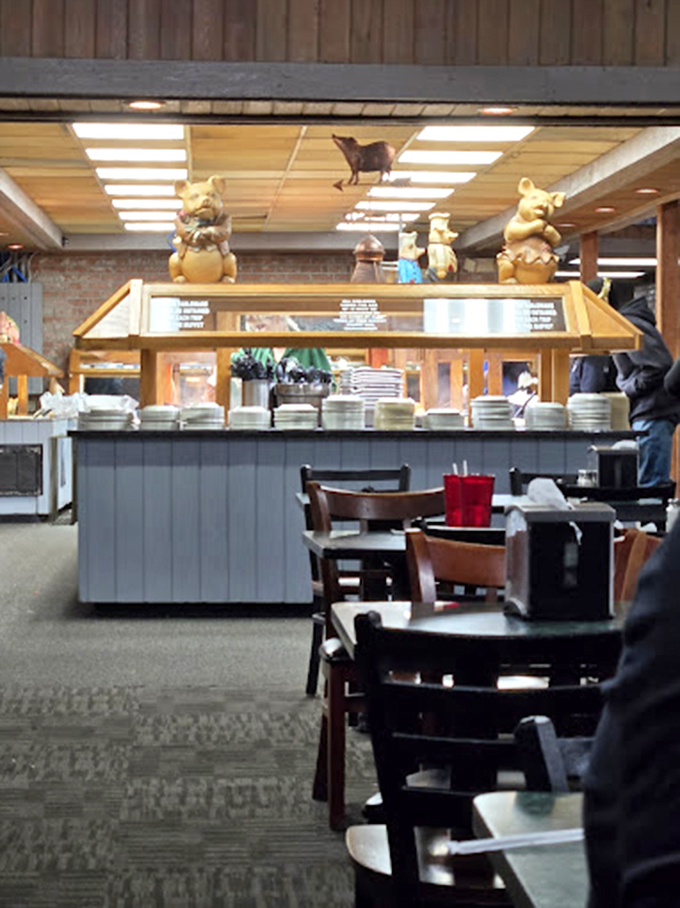 Clean plates await their destiny at the buffet station. Those pig figurines standing guard seem to say, "Go ahead, we won't judge your third trip."