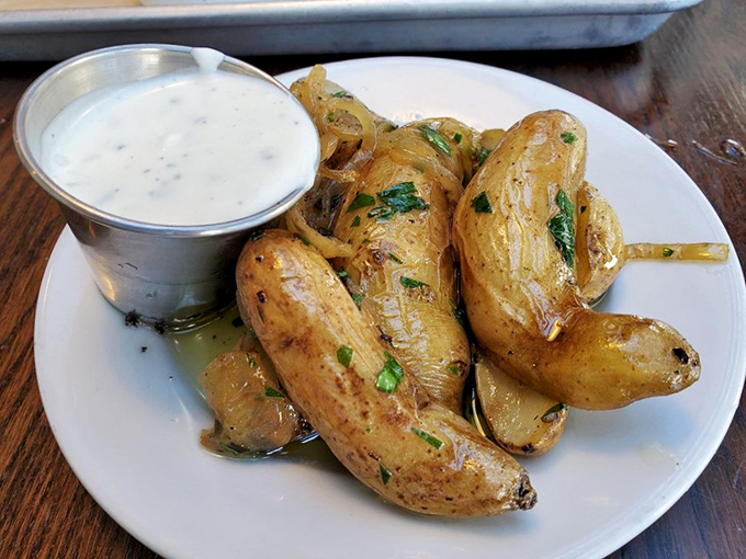 Roasted potatoes that achieve the impossible trifecta: crispy exterior, fluffy interior, and seasoning that makes you forget ketchup exists.