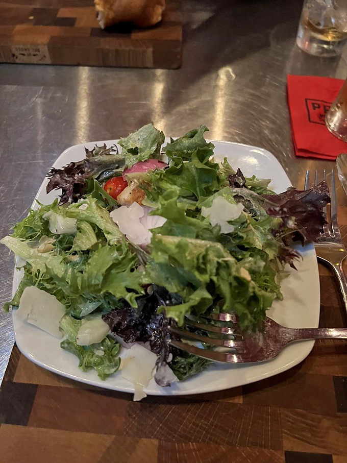 Even salads get star treatment here. Fresh greens, shaved parmesan, and careful composition prove that vegetables can hold their own on the menu.