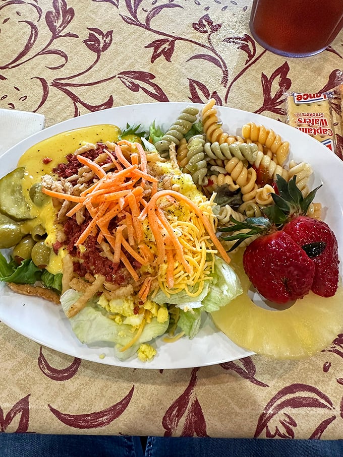 A salad that understands its supporting role in the meat-centric drama. Those tri-colored pasta spirals and grated cheese add vintage charm to leafy greens.