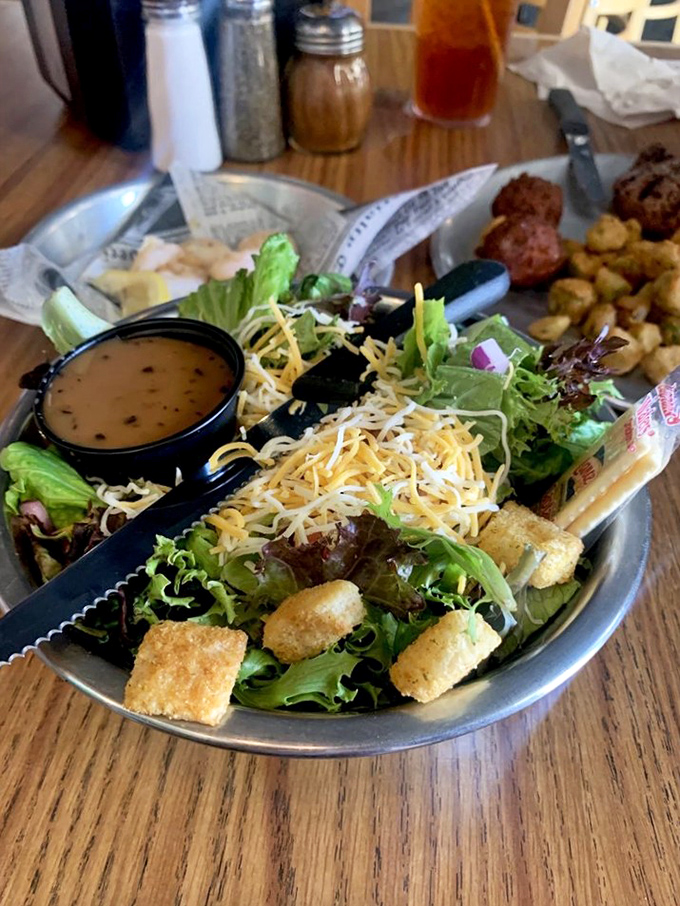 This isn't just a salad &ndash; it's crisp greens doing their civic duty by providing a brief vegetable intermission in your seafood symphony.