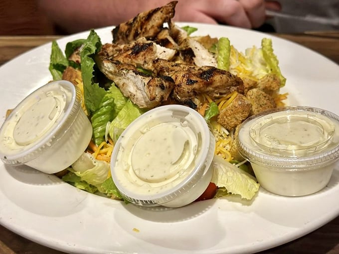 A salad that doesn't apologize for being healthy, boldly accompanied by grilled chicken that clearly spent quality time with some excellent spices.