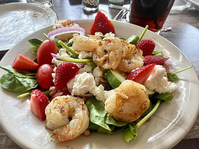 A salad that doesn't apologize for being healthy. Those grilled shrimp and fresh strawberries are proof that Bear's Den respects more than just meat.