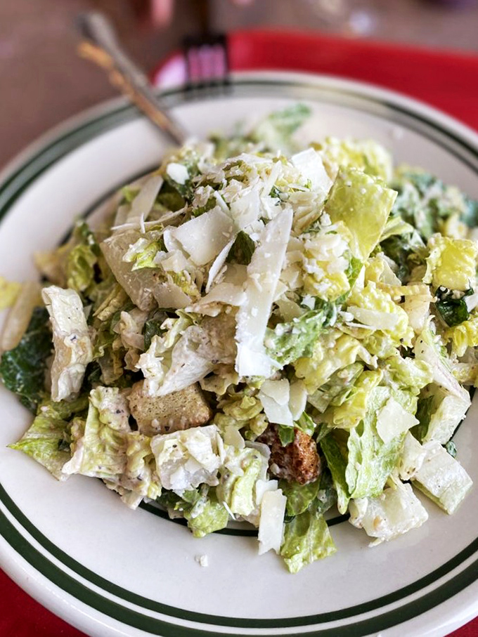 A Caesar salad that brings enough freshness to balance your seafood indulgences, providing the illusion of healthful dining.
