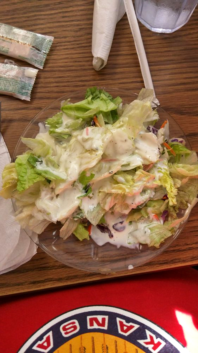 This salad isn't trying to be healthy &ndash; it's just taking a quick breather between bites of fried goodness. Respect the ritual.