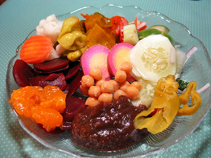 The seven-sweets-and-seven-sours tradition lives in this colorful relish tray, a kaleidoscope of pickled vegetables that cleanses the palate between bites.