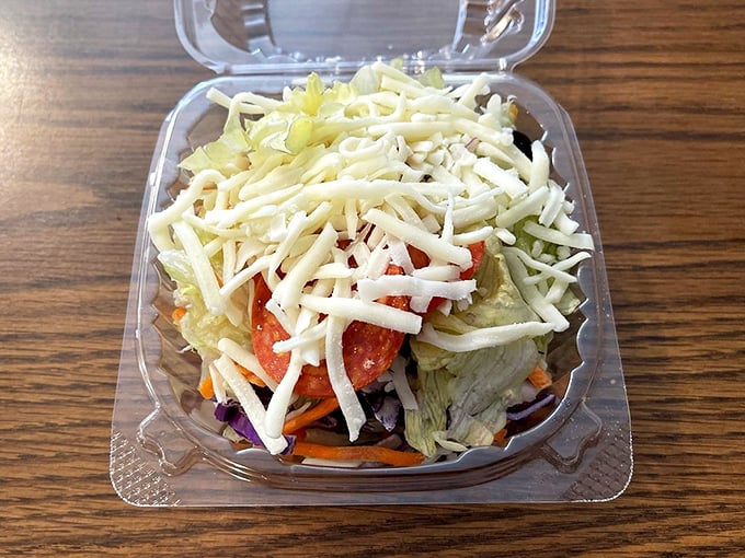 The garden salad exists as a token gesture toward nutrition. It's the food equivalent of bringing a dictionary to a rock concert.