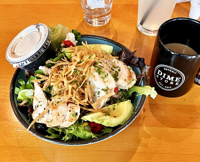 A salad that doesn't feel like punishment, topped with protein and crispy elements that make eating greens before noon something to actually look forward to.