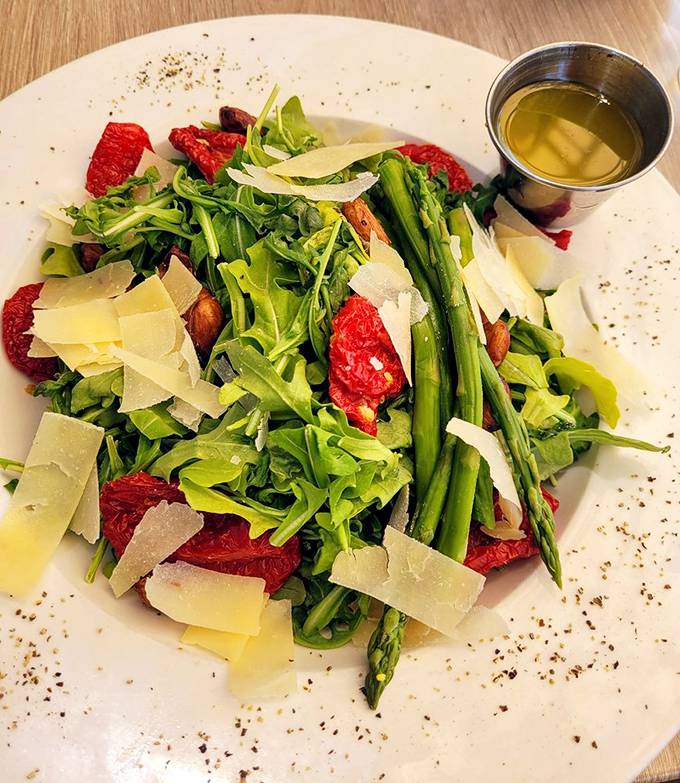 A salad that doesn't apologize for being healthy. Arugula, asparagus, and sun-dried tomatoes proving vegetables can party in Vegas too.
