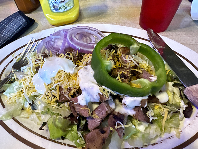 A steak salad that doesn't apologize for its protein-forward agenda. That jalape&ntilde;o ring isn't a garnish &ndash; it's a challenge.