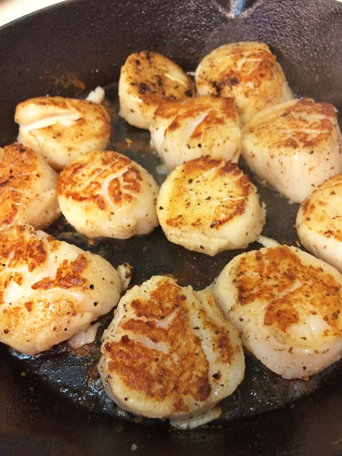 Perfectly seared scallops with that golden crust that separates amateurs from professionals. Cast iron perfection in twelve delicious pieces.
