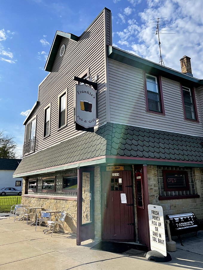 The curved wooden bar invites elbows and stories in equal measure. This is command central for burger operations and beer diplomacy.