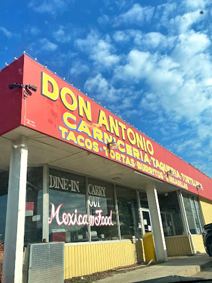The sign promises Mexican food without pretense. Against the blue sky, it serves as a landmark for those in search of authentic flavors.
