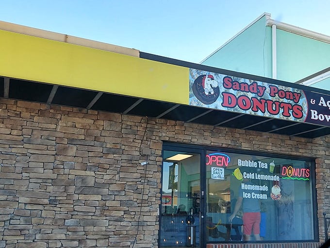 The siren call of Sandy Pony beckons from beneath a sunny yellow awning. Those stone walls hide treasures more valuable than gold&mdash;fresh donuts.