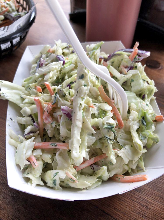 Coleslaw that actually deserves respect—fresh, crisp, and thoughtfully dressed rather than drowning in a mayo tsunami.