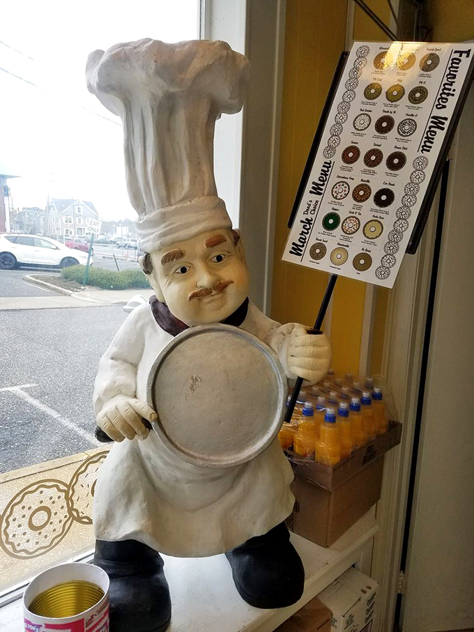 The unofficial mascot of Uncle Dood's stands guard, silently judging whether you're worthy of the sugary treasures within.